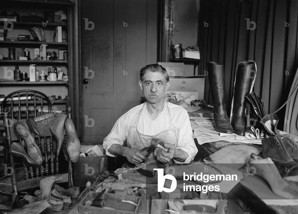Image of Traditional shoemaker in his workshop is Tony Bruno of Washington,