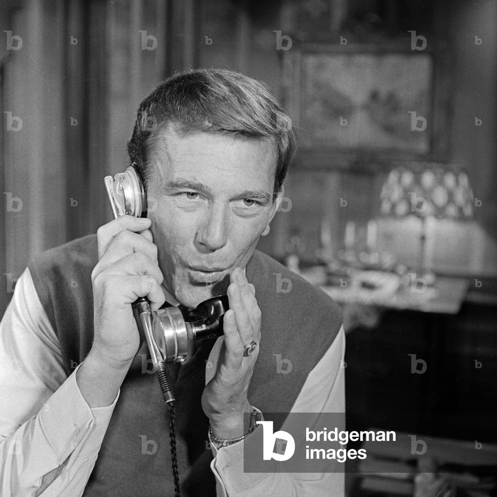 Image of German actor Hellmut Lange on the phone, Germany 1960s