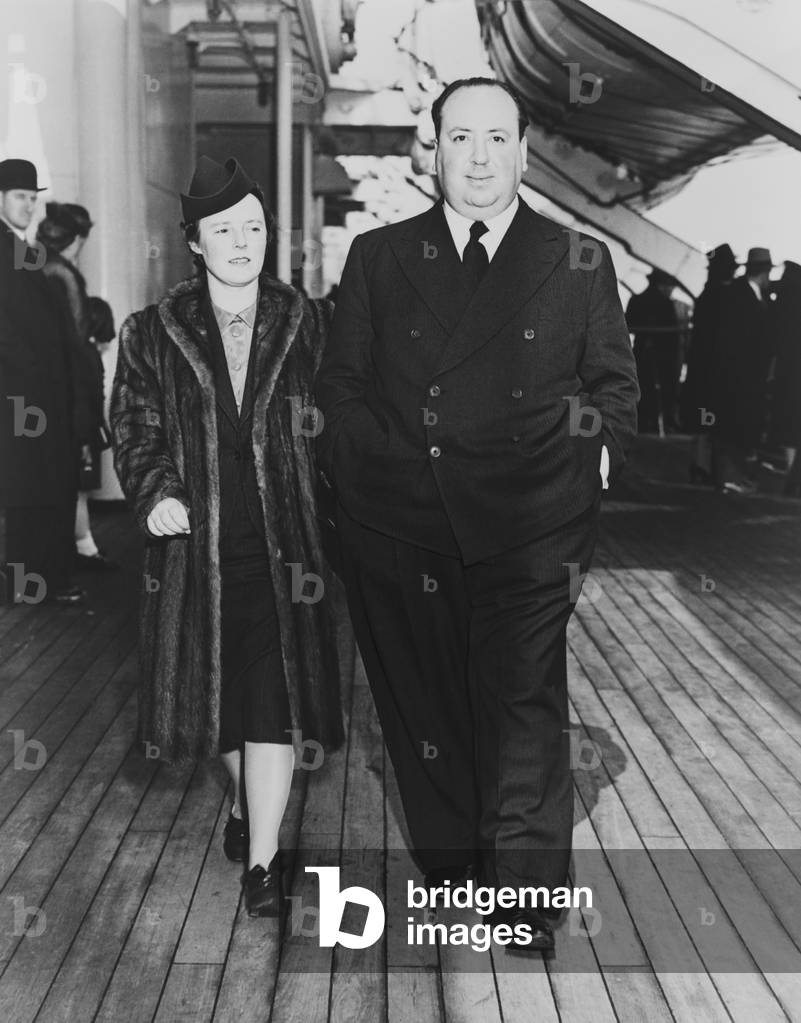 Image of Alfred Hitchcock and his wife, Alma Reville, on deck of