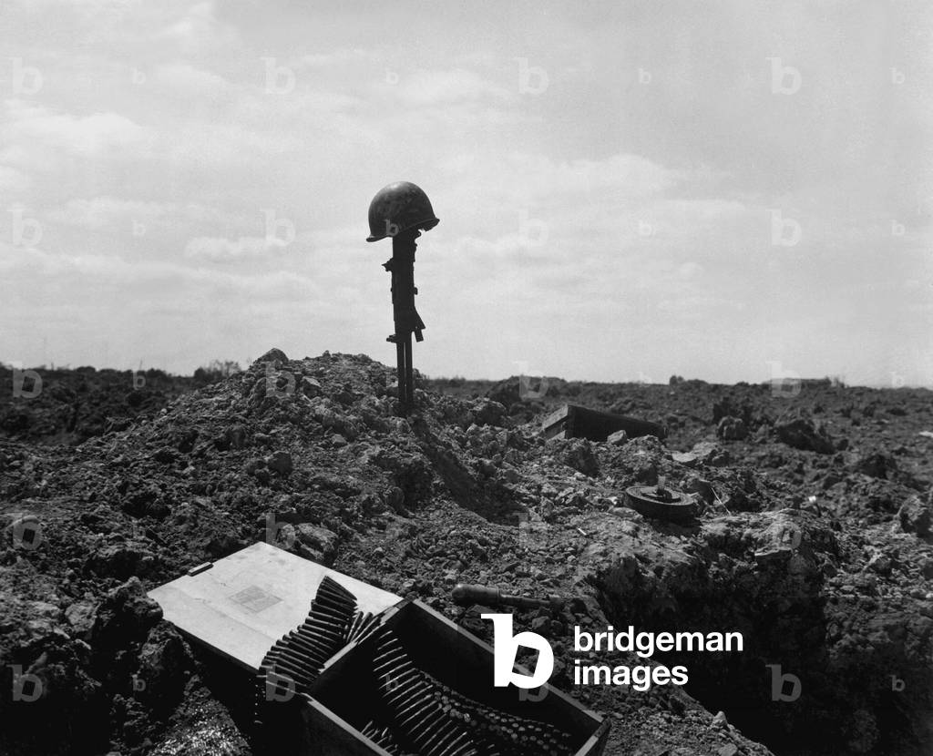 Image of Helmet and rifle monument to a dead U.S. soldier on