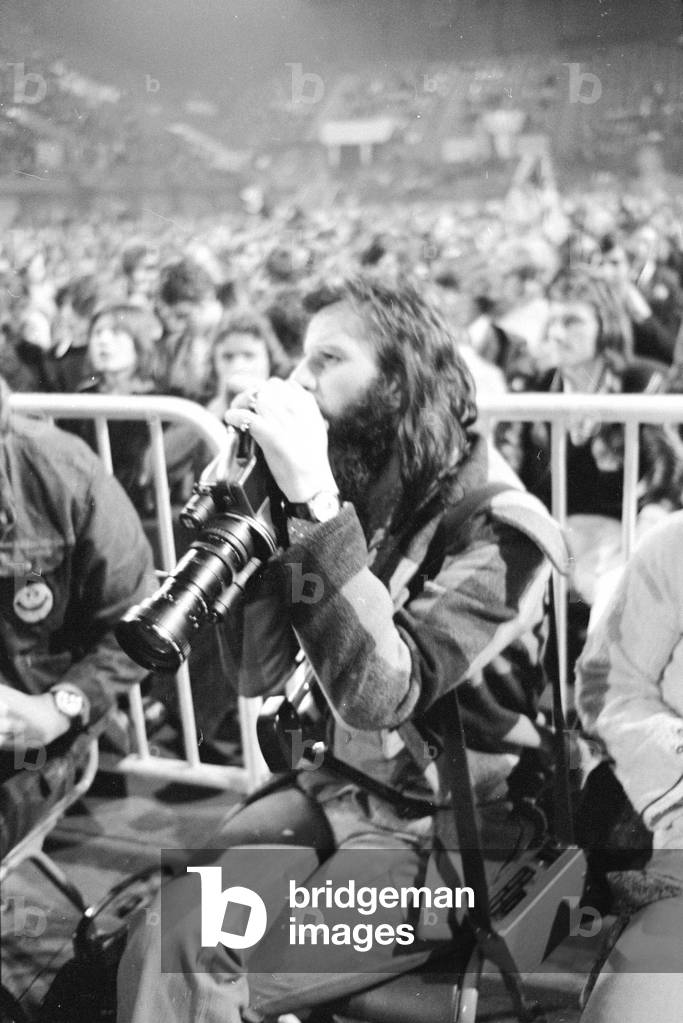 Ringo Starr Riding A Dinosaur