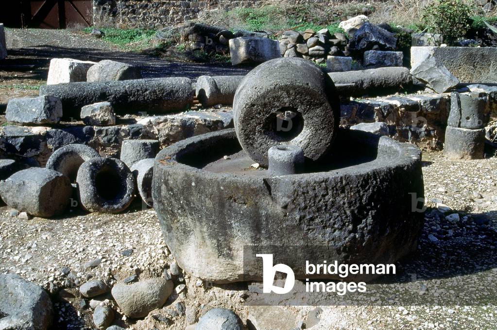 Image of An ancient millstone for grain, at Capernaum, on Lake Tiberias,