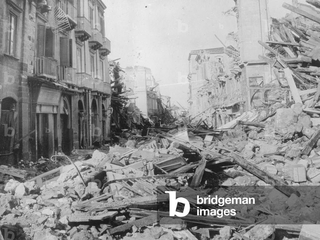 Image of A view of demolished buildings in a street in Messina, by ...
