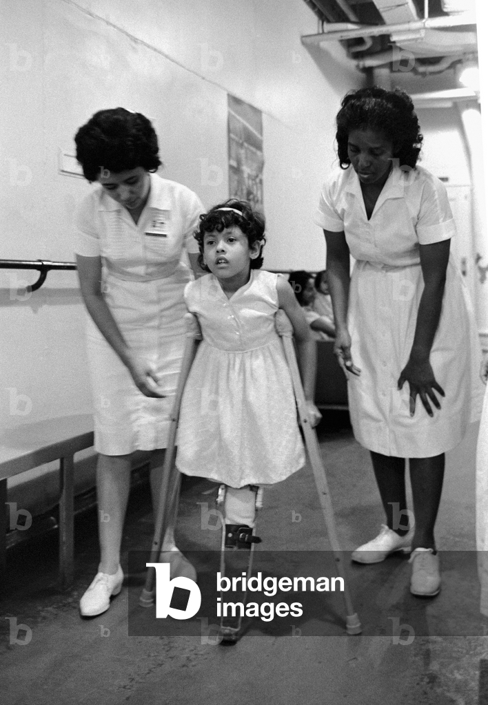 Image of Young girl without legs learns to walk with prosthetic leg by ...