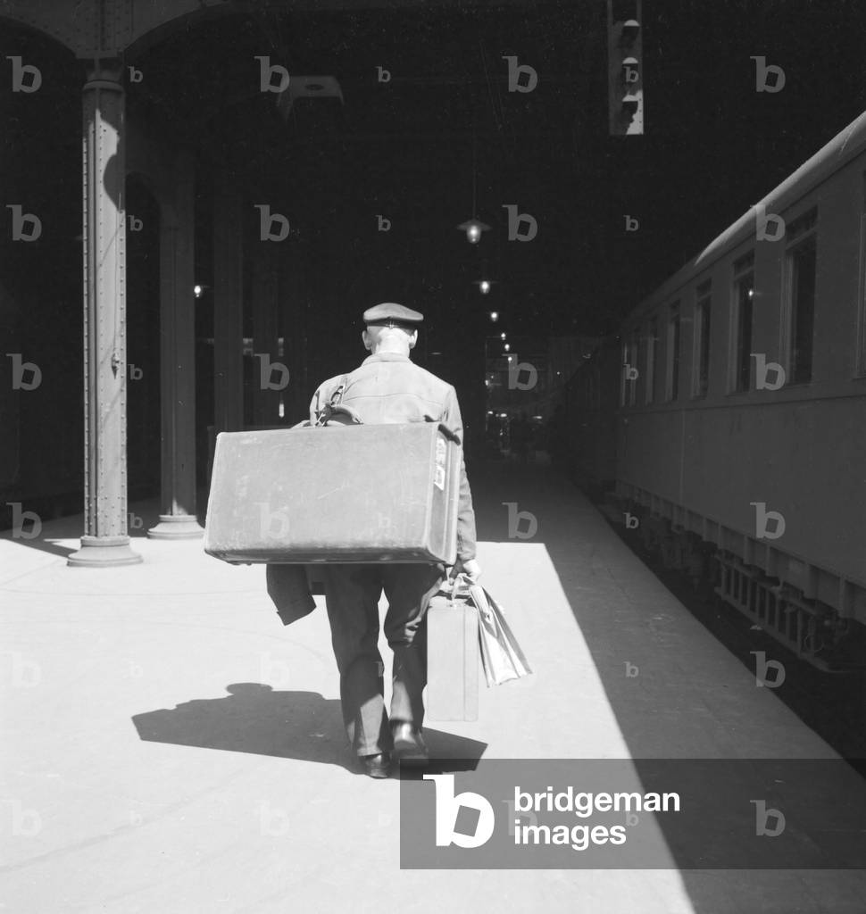 Image of Baggage porter at a platform of Hamburg main station, Germany