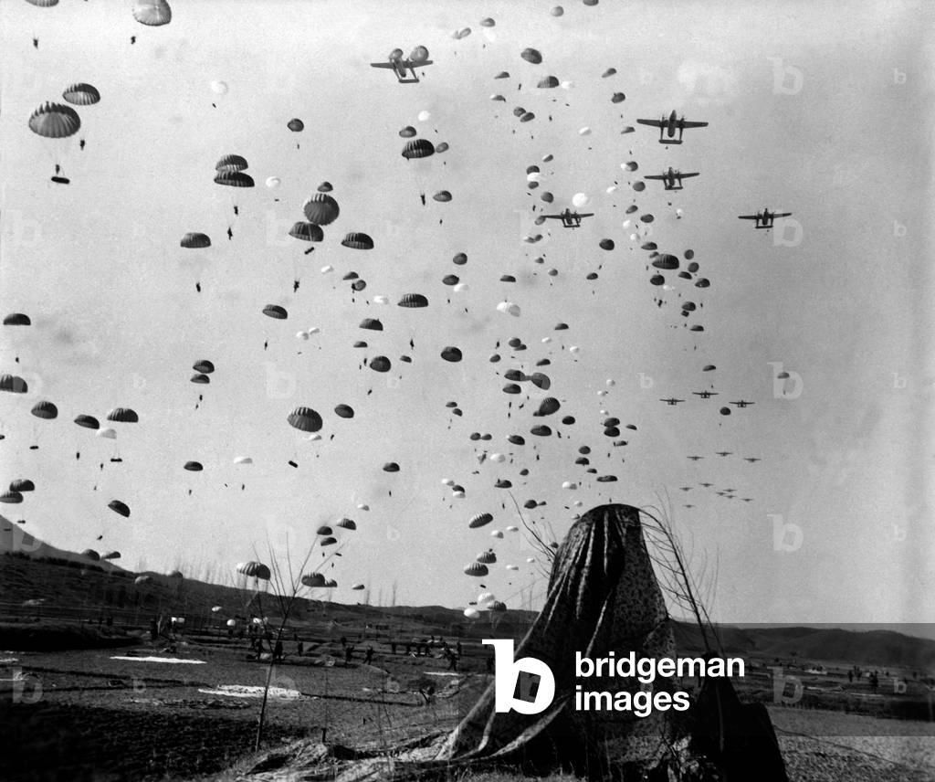 Image of Paratroopers of the 187th RCT parachuting from C-119's, 1951