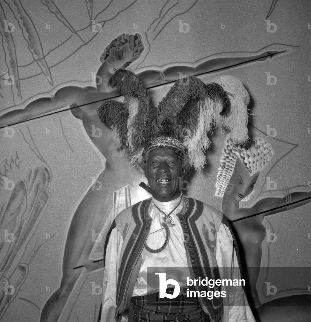 Image of Ras Prince Monolulu (Peter Carl Mackay) during a party at