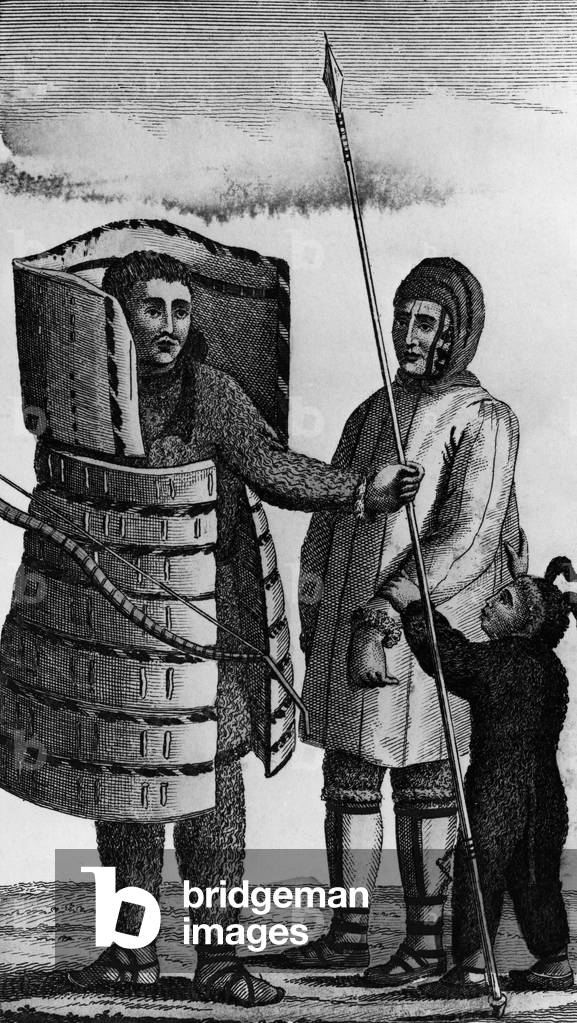 Image of Siberian Chukchi man holding bow and spear, with his wife