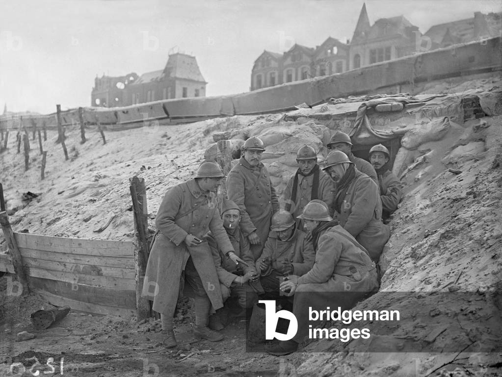 Image of Soldiers warming themselves by a brazier, Nieuwpoort, Belgium ...