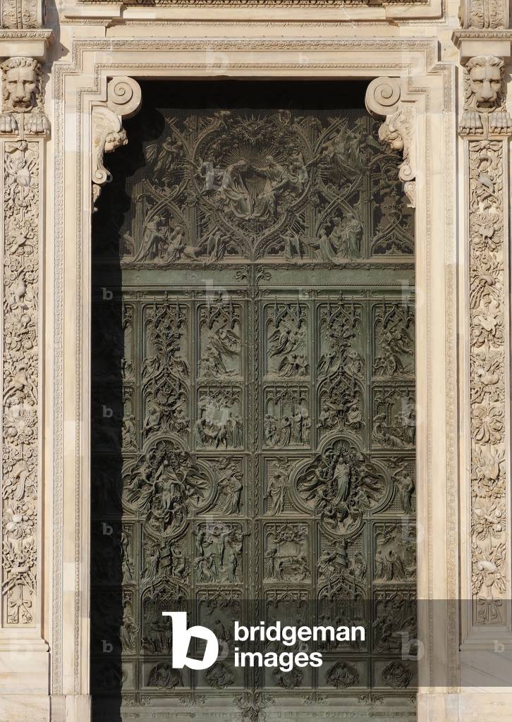 Milan Cathedral. Bronze door designed by Italian sculptor Ludovico ...