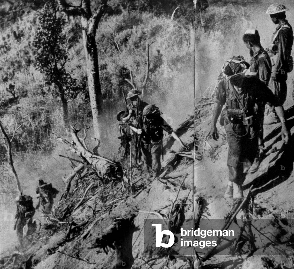 Image of Soliders Advancing Up a Hill in the Jungle, 1942 (b/w