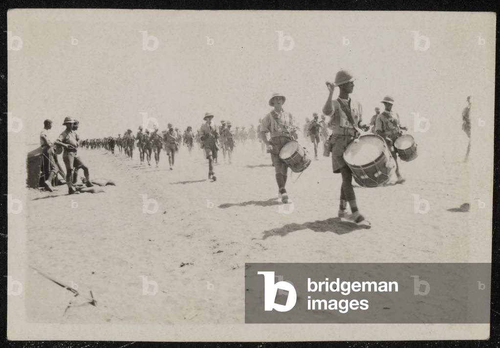 Image of Drummers leading British troops on a march across the desert ...