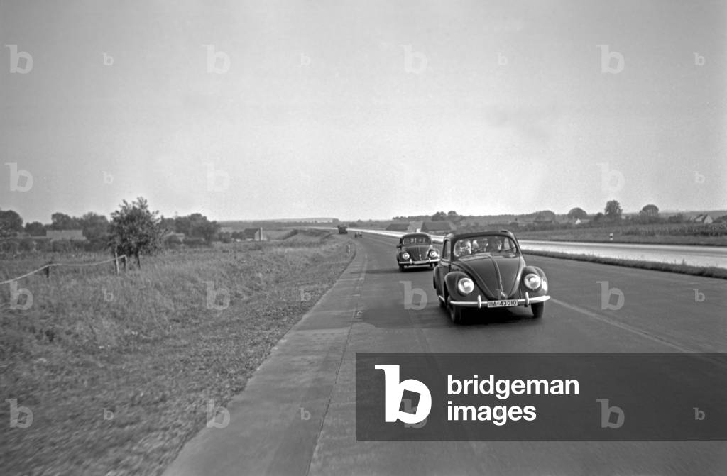 Image of Two model of the Volkswagen beetle, or KdF car, with