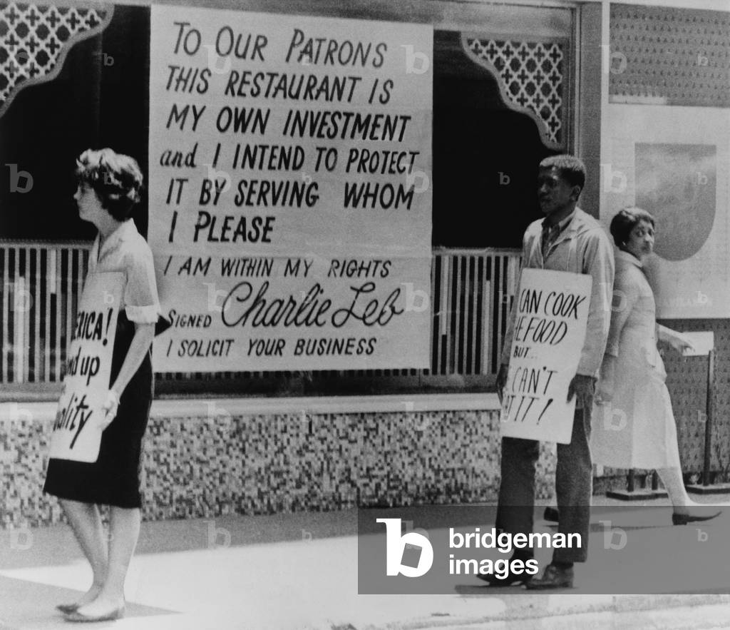 Image of People picketing outside an Atlanta restaurant which displays ...