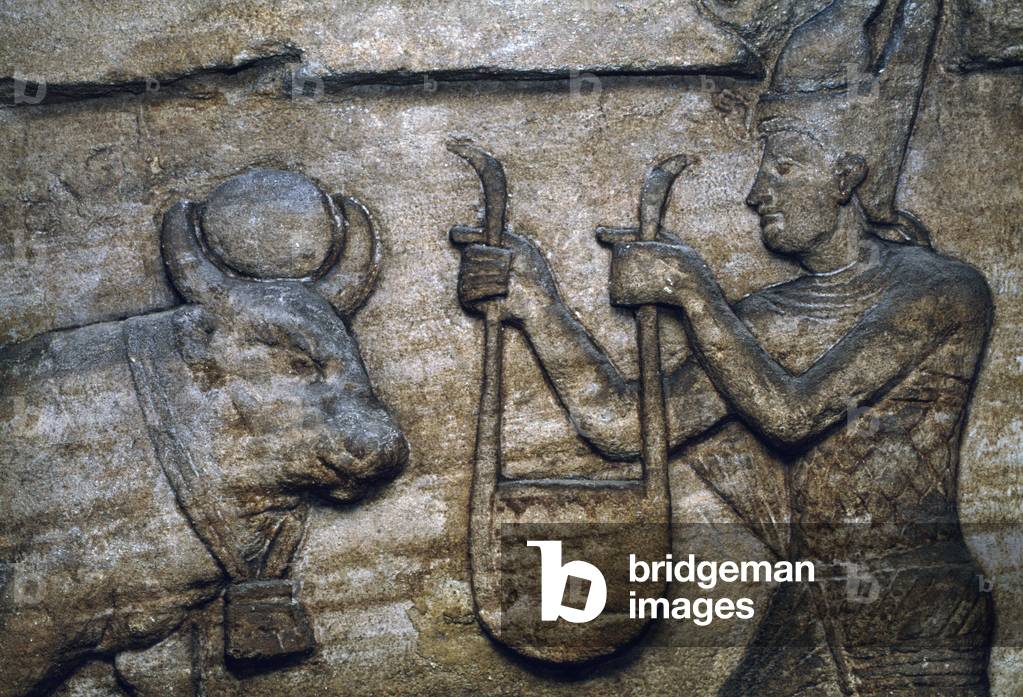 Image of A man with an ox, bas-relief, Catacombs of Kom el-Shoqafa,