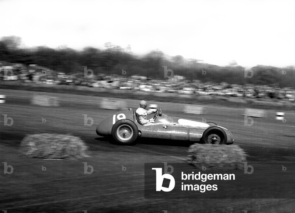Image of Louis Chiron in a Maserati at the British GP at