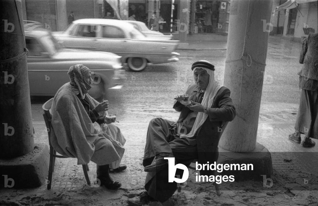 Image of Kuwaiti men under an arcade, Kuwait City, Kuwait