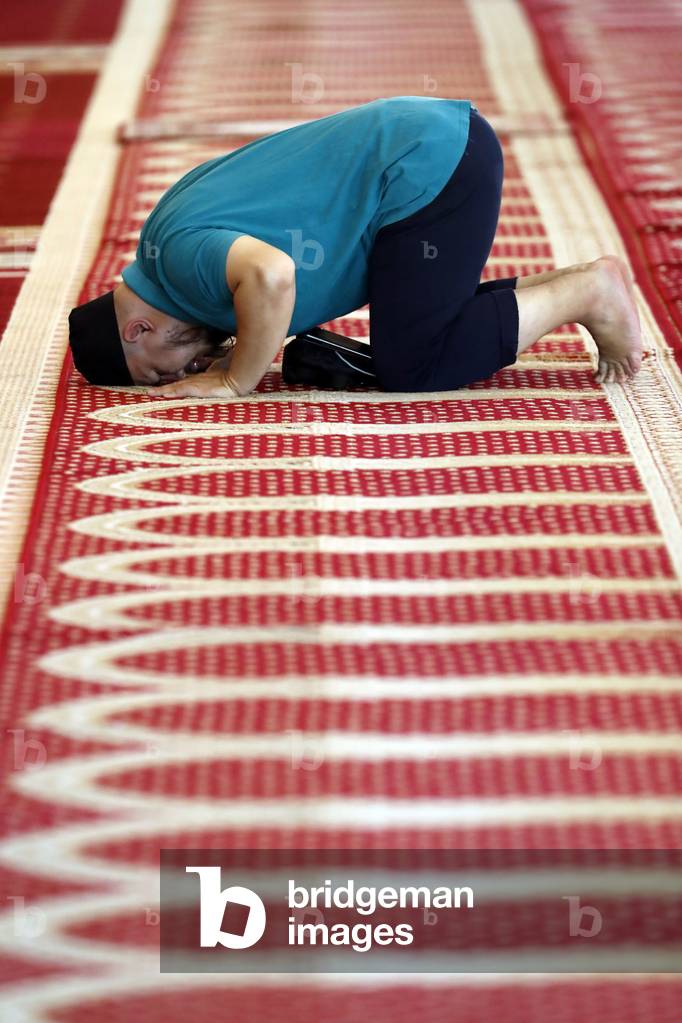 Image of The National Mosque or Masjid Negara, Prayer hall, Muslim man