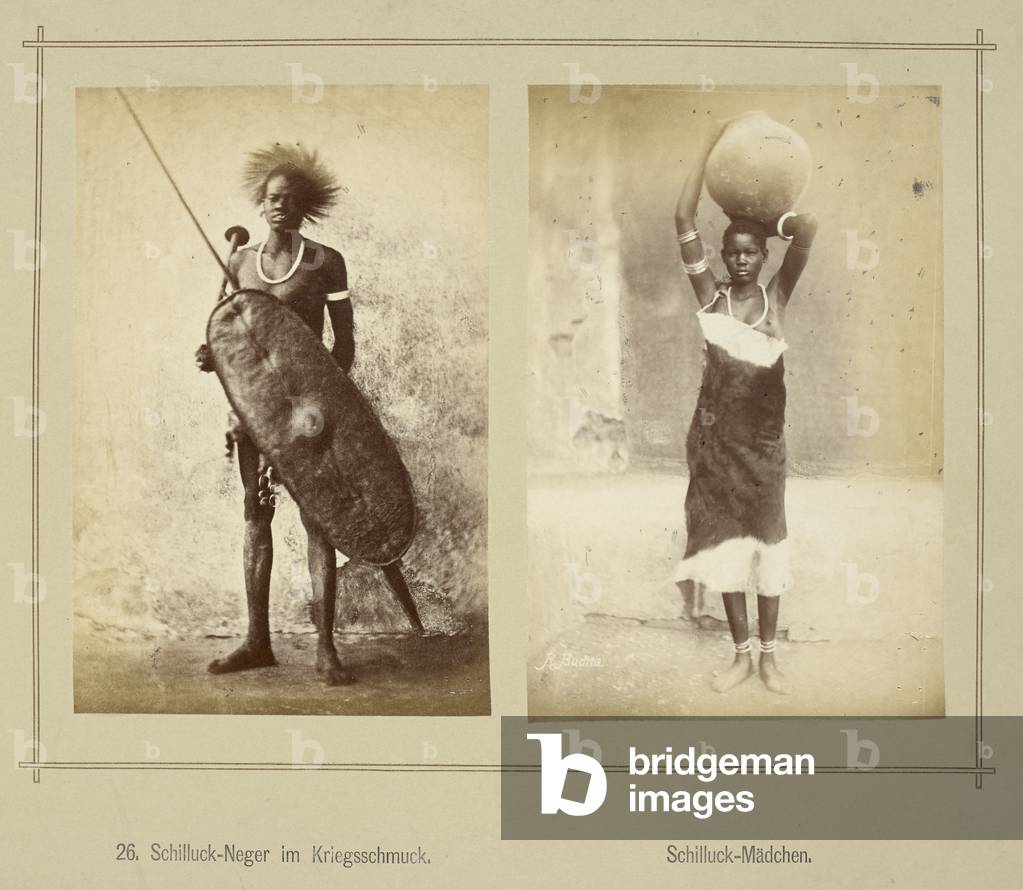 Image of (Left) A young Shilluk warrior, holding hide shield, spear and