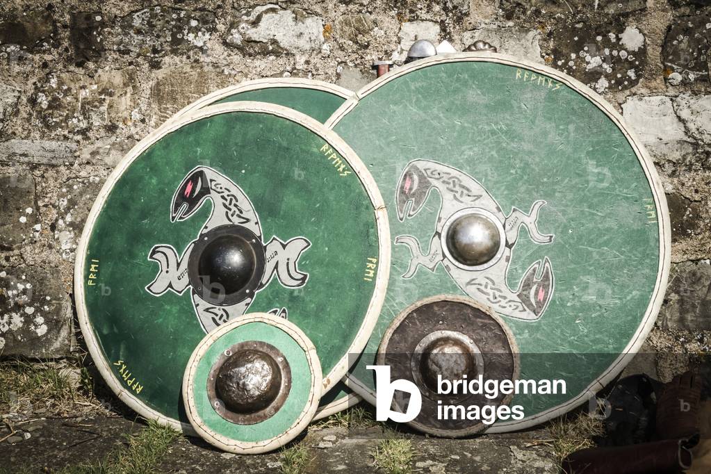 Image of Historical reenactment: Round Viking shields with central iron ...