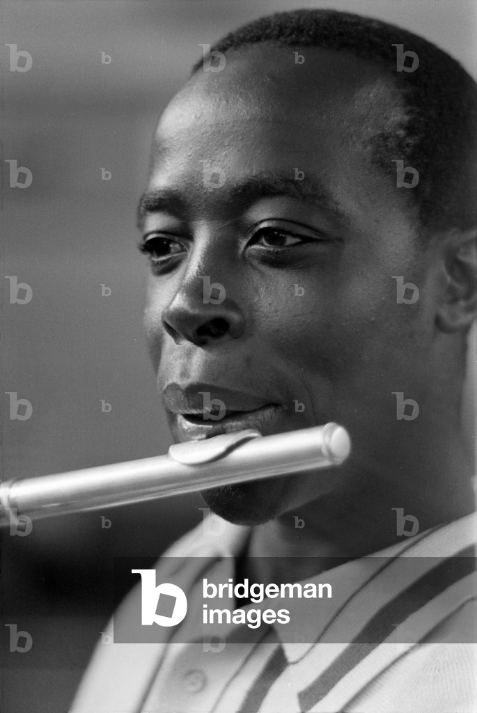 Image of Black and white photo of Robert Sithole playing the flute