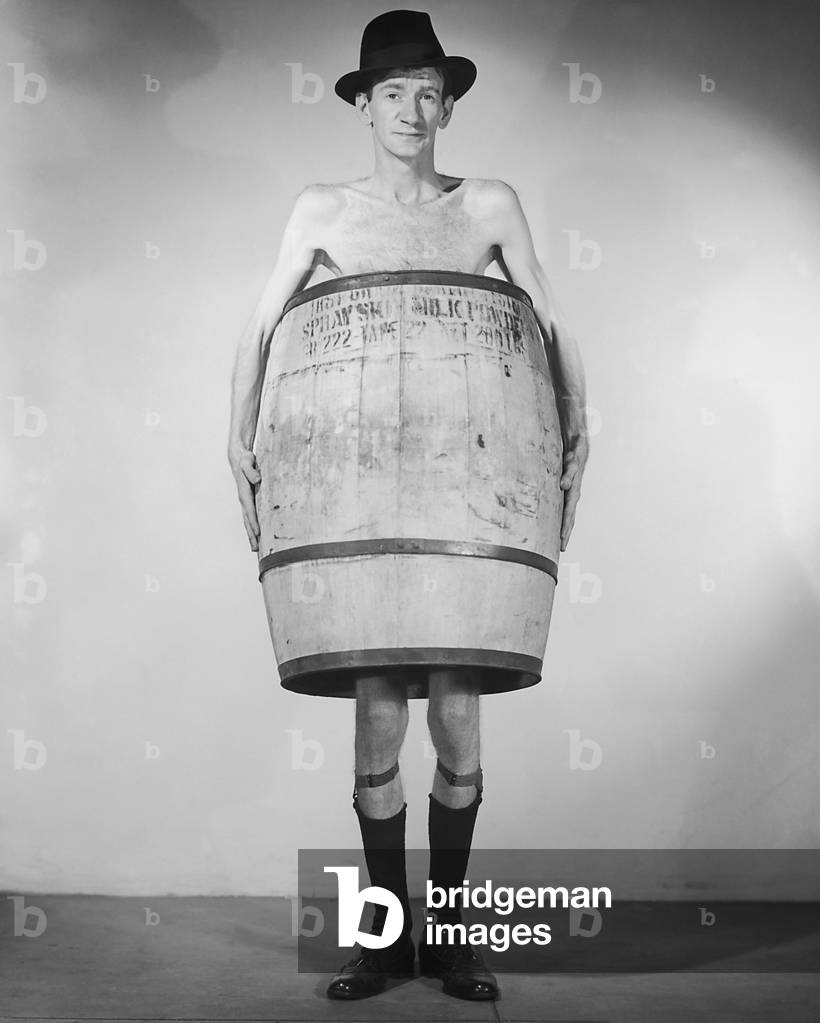 Image of Man wearing barrel (b/w photo)