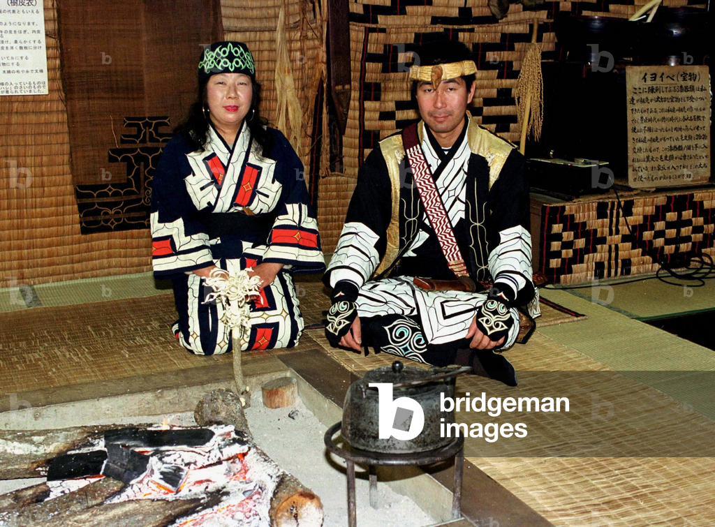 Image of Ainu couple in traditional dress at the Ainu Museum in by ...