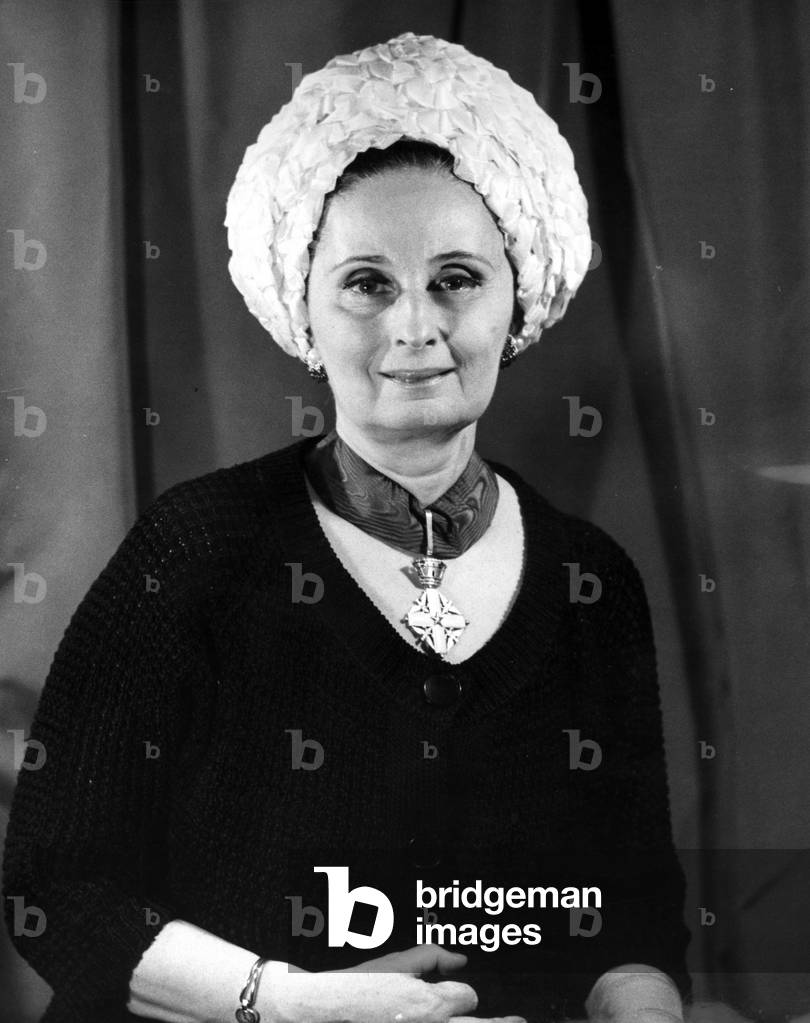 Image of Biki wearing the medal of Commander of the Order of