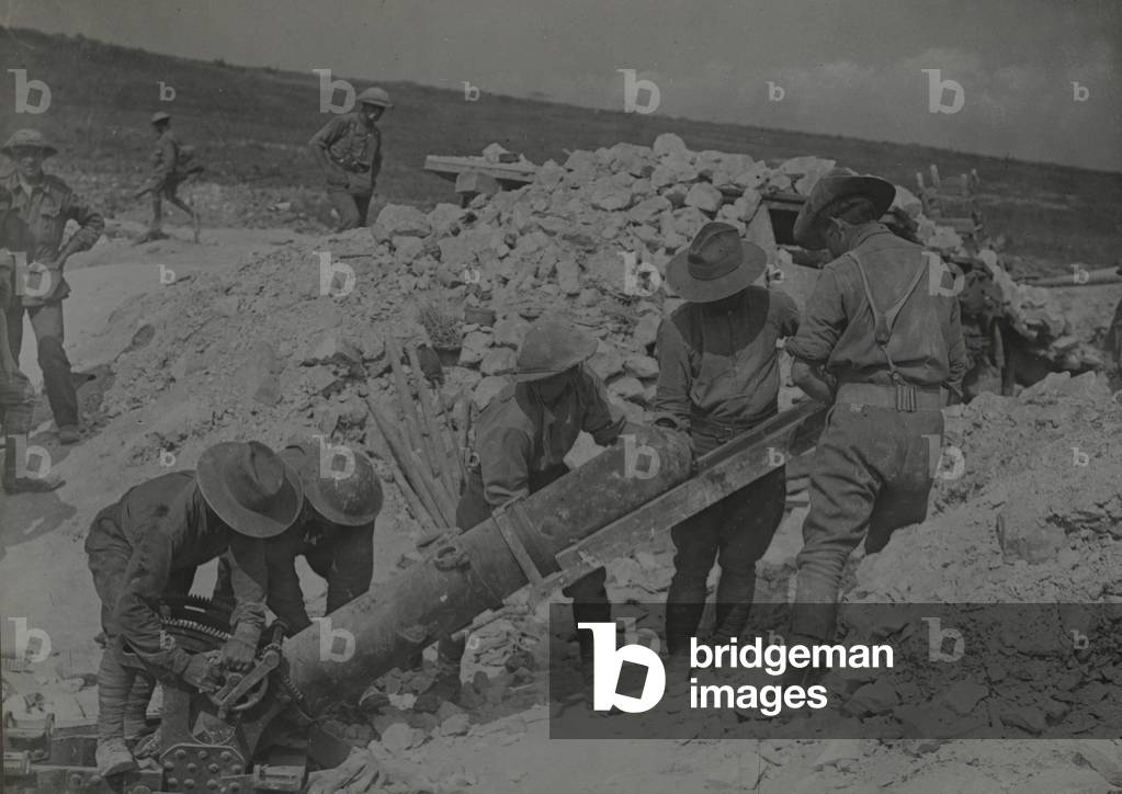 Image of Australian troops loading a 9.45 inch trench mortar on the by ...
