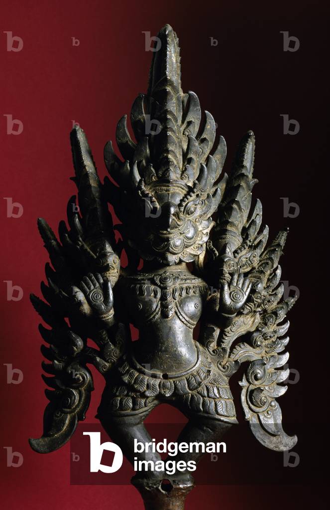 Image of Garuda and the serpent Naga, bronze ornament of a chariot.
