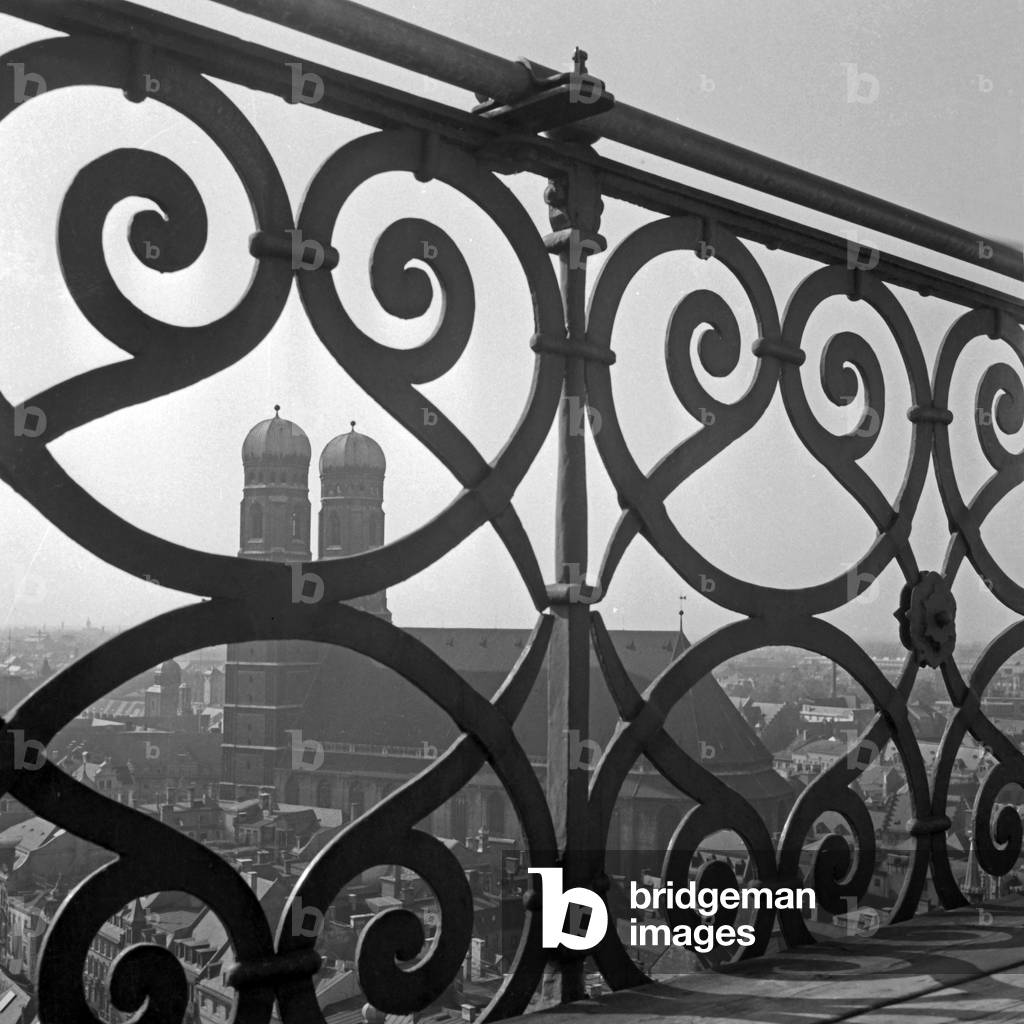 Image of View to Munich Frauenkirche church through the railing of the
