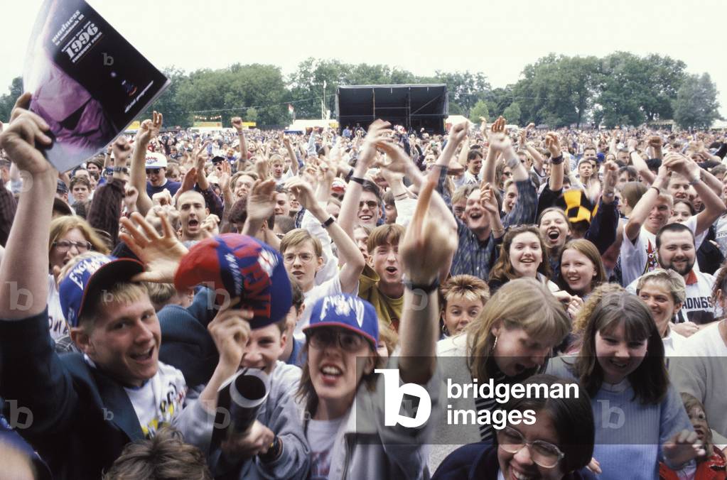 Audience cheering at Madness concert, 1996. Crowd, rock, ska. Waving ...
