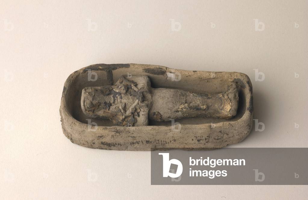 Miniature coffin and falcon headed figure, possibly representing the ...