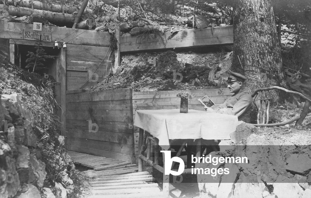 Image of A German soldier sat outside in his nicely built trench,