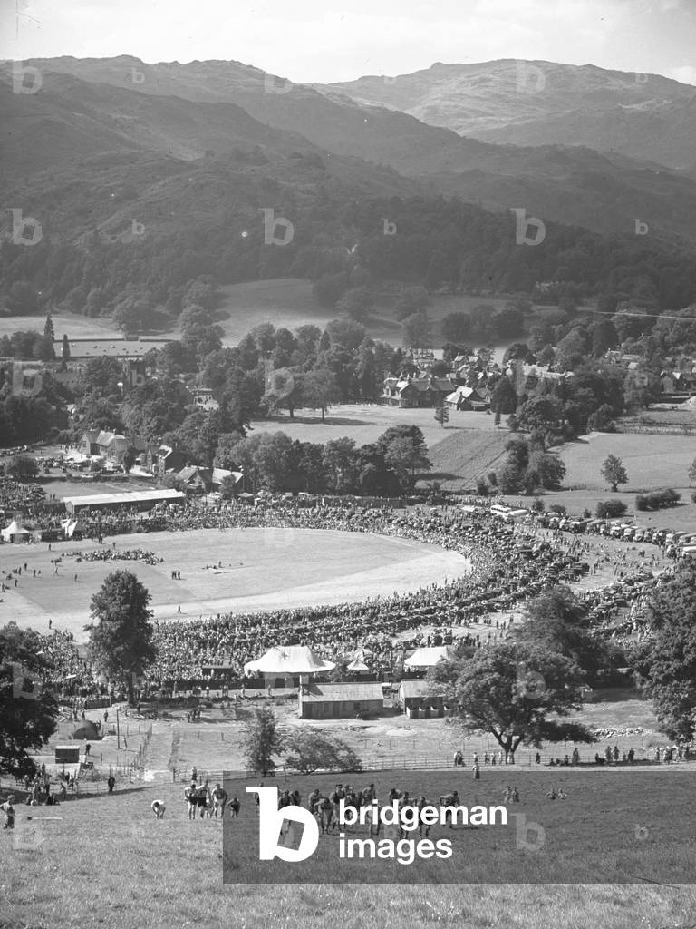 Image of Fell runners coming up hill and looking down on crowds by ...