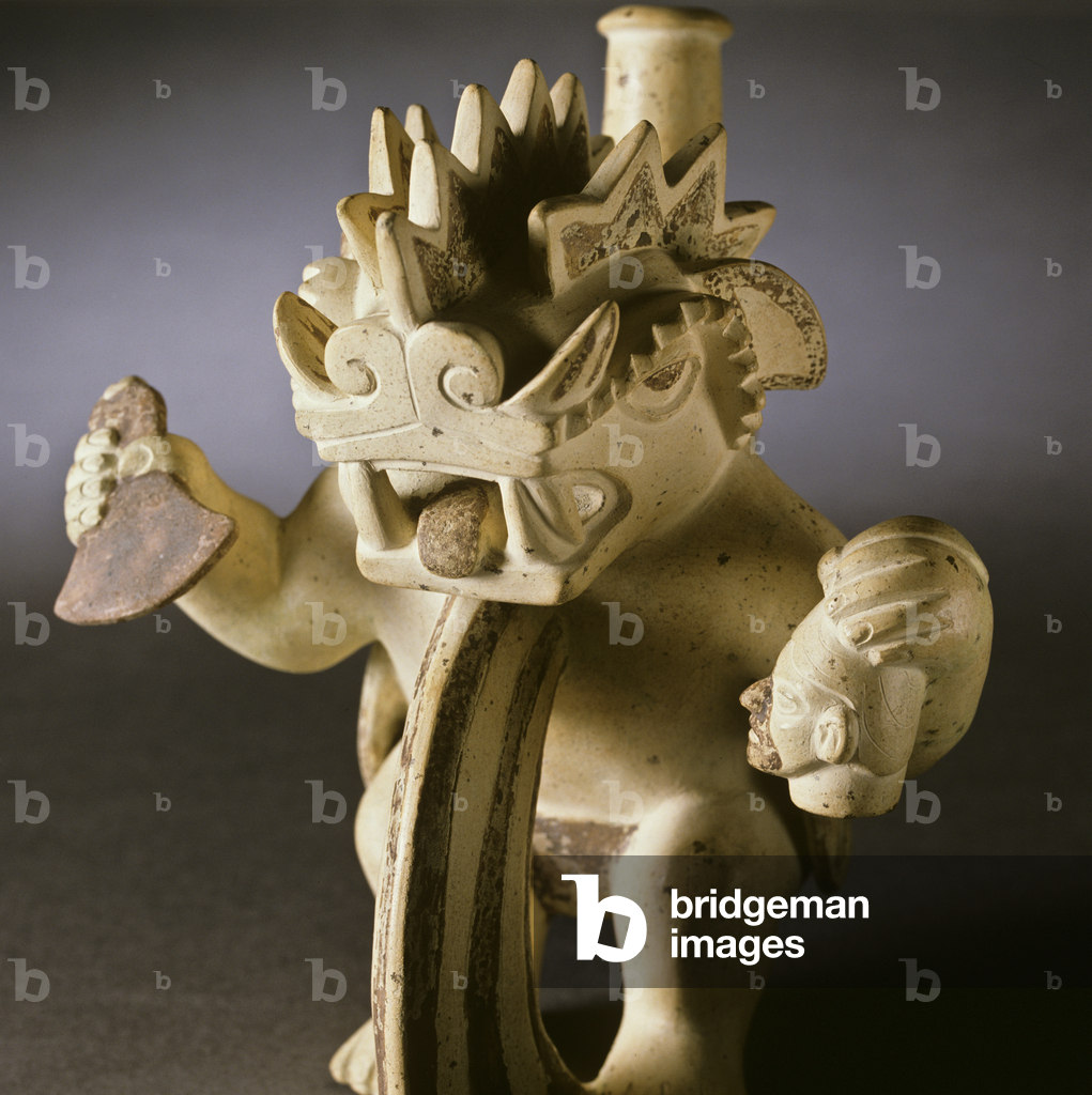 Image of Moche ceramic vessel of a decapitator monster holding a tumi ...