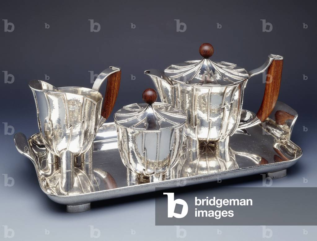 Image of A Wiener Werkstatte hammered four-piece silver and teak tea ...