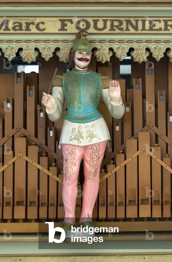 Image of Detail of colourful animated figure on a large barrel organ