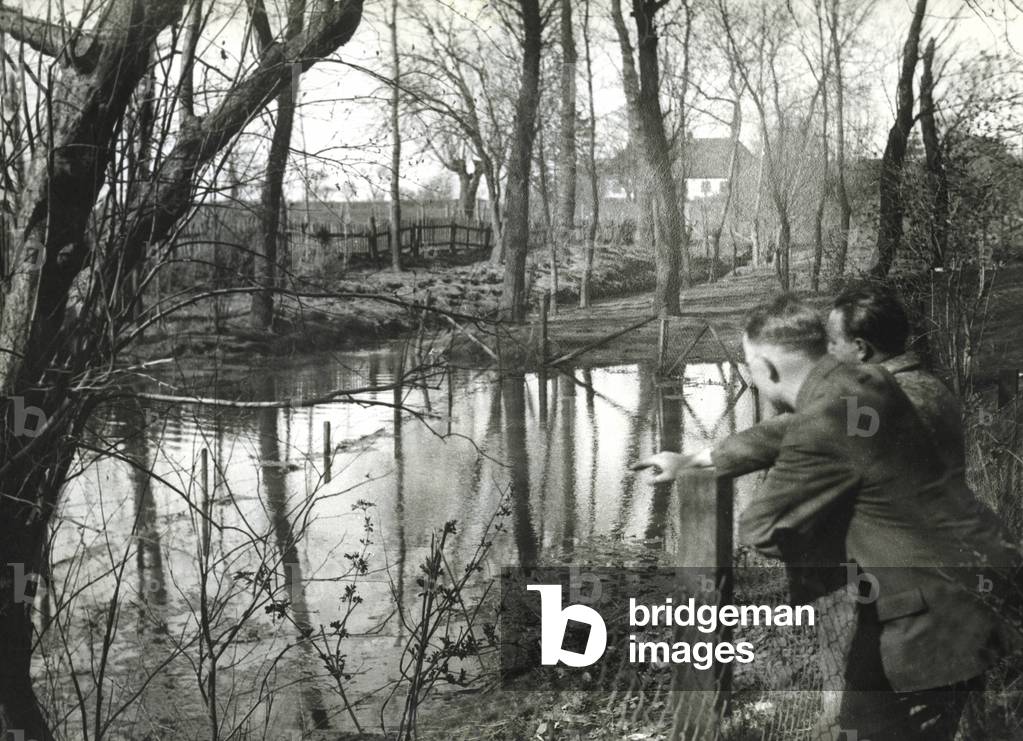 Image of A pond divided by the border at Danzig, around the