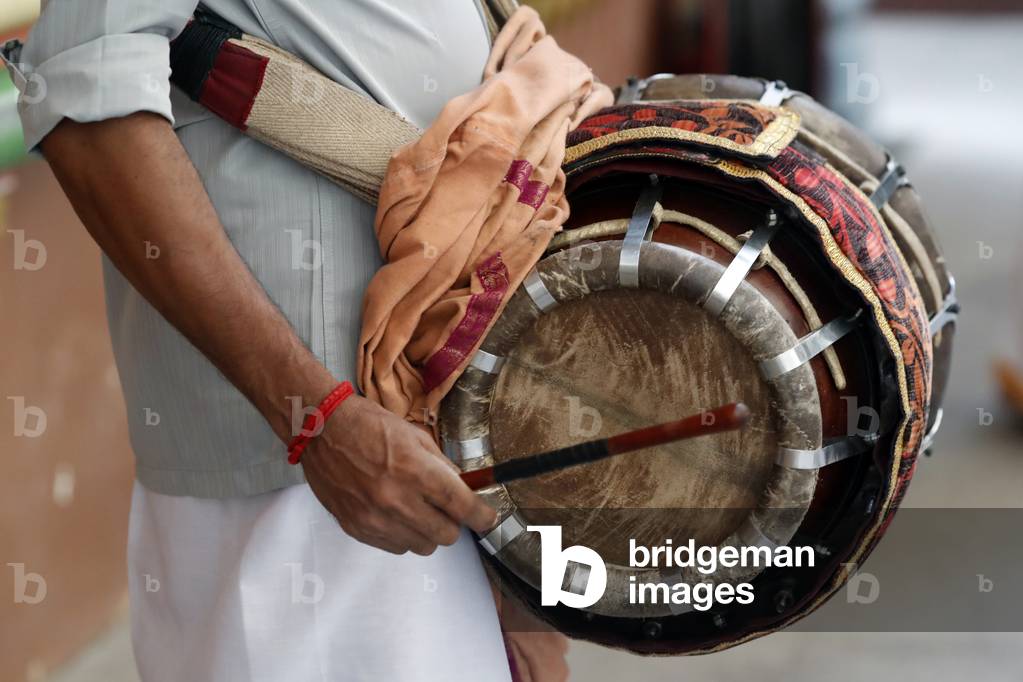 Image of Sri Mahamariamman Hindu Temple, Musician playing a Thavil ...