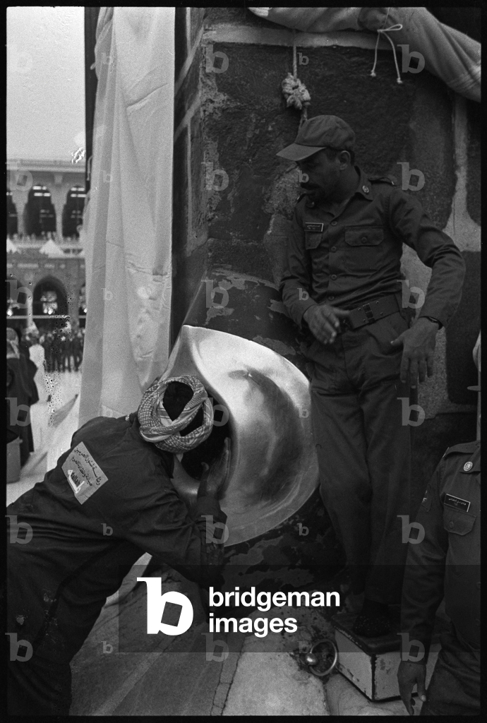 Image of Saudi policeman guarding the holy Black Stone, believed to be ...