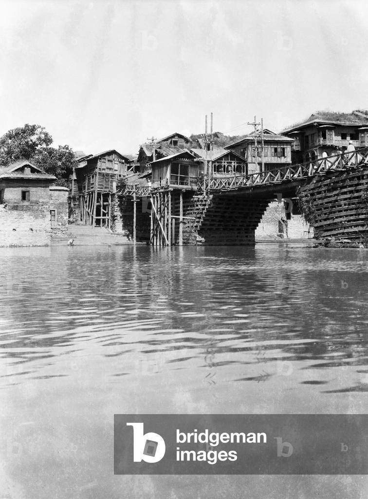 Image of Wooden bridge and buildings Gulmarg, Kashmir, 1932 (b/w photo)
