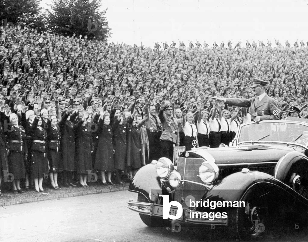 Image of Adolf Hitler during a round trip through the stadium on