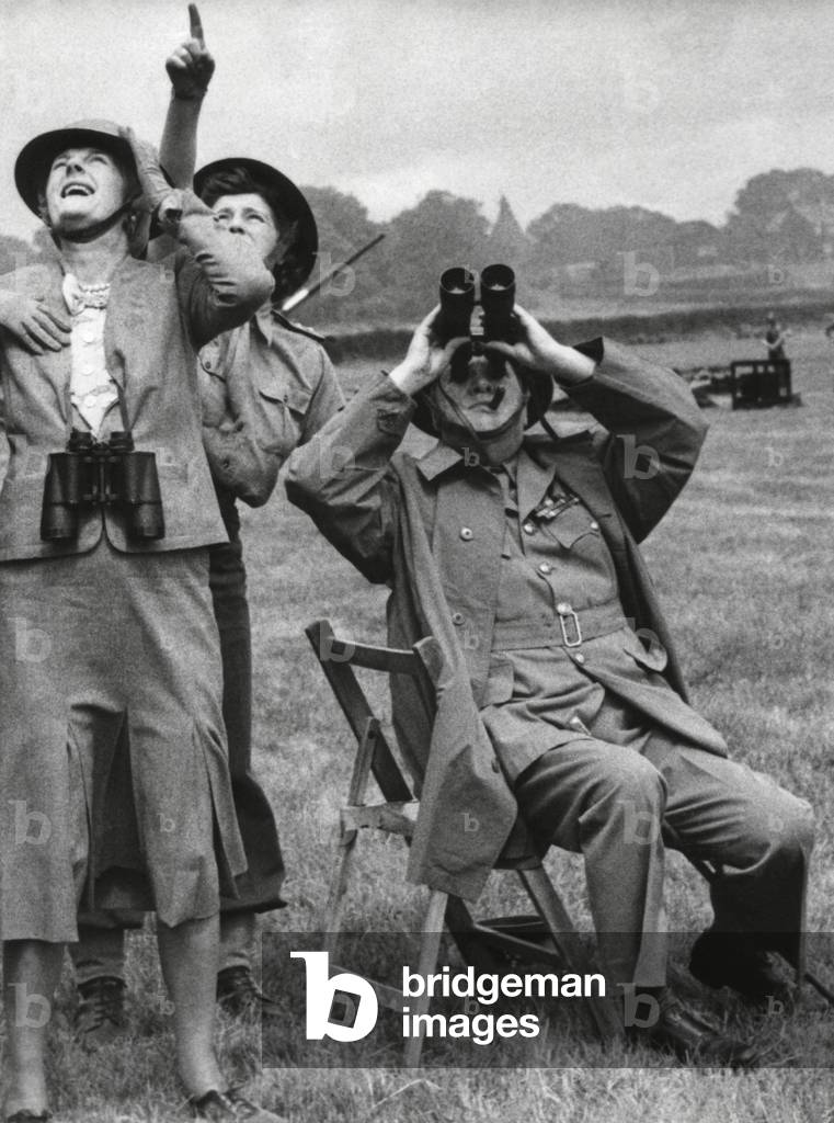 Image of Prime Minister and Mrs. Churchill watching a fighter intercept a