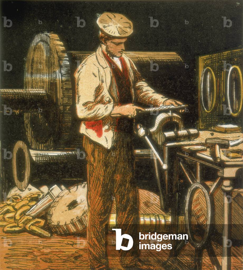 Image of The Engineer using a file on an engine part held