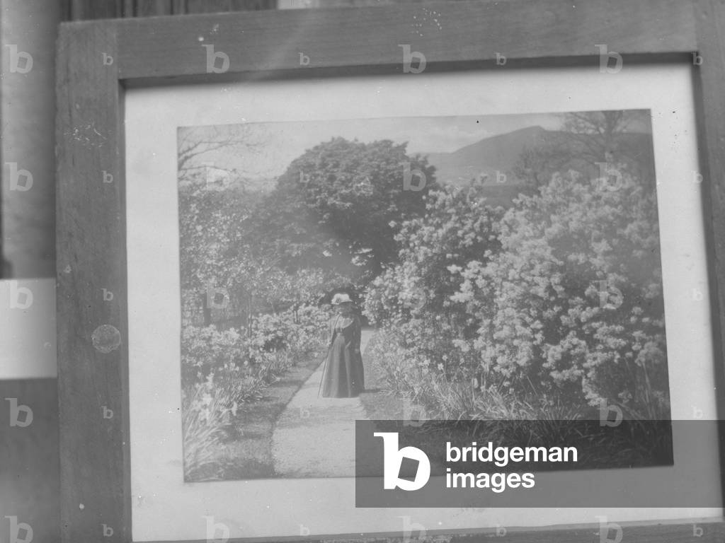 Image of A framed photograph of a woman standing on a path by Hardman ...