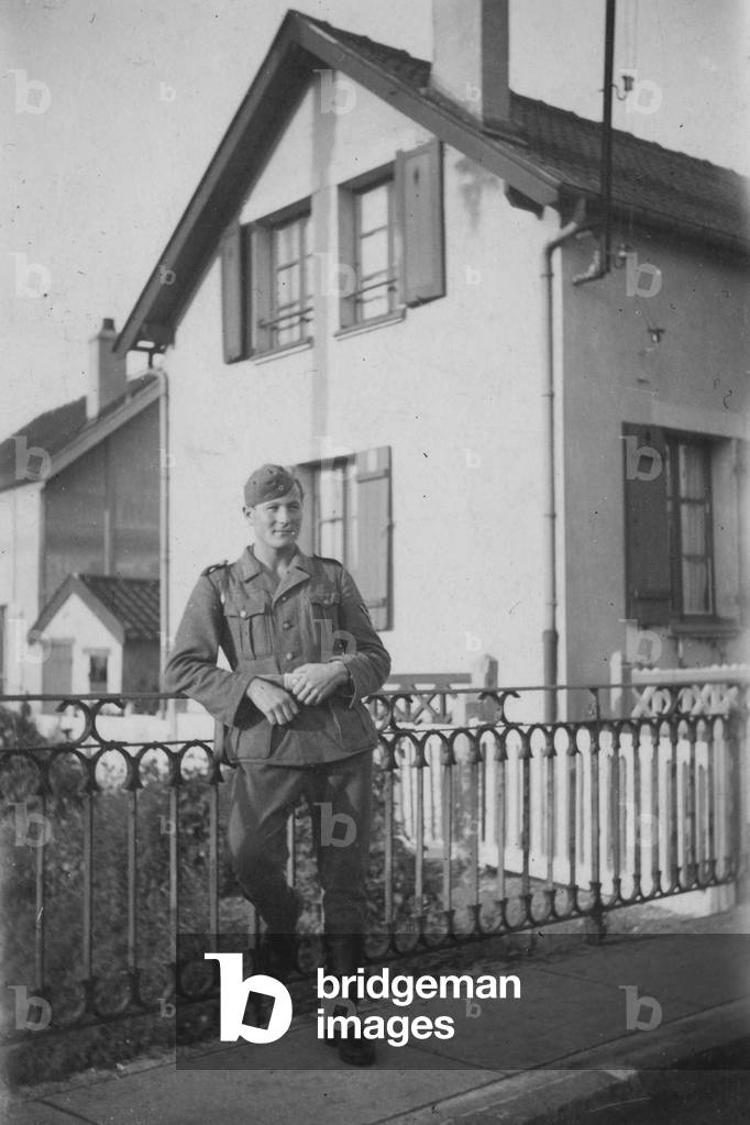 Image of A German Soldier Leaning and Resting on a Fence, 1942
