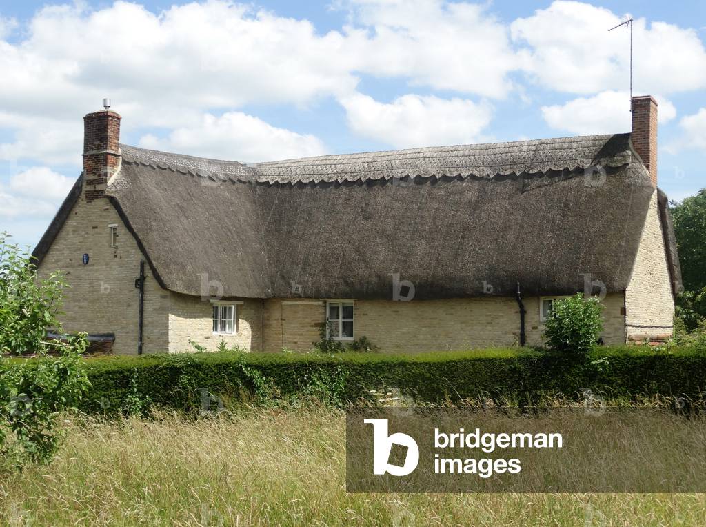 Image of Traditional 17th century thatched cottage on the estate at ...
