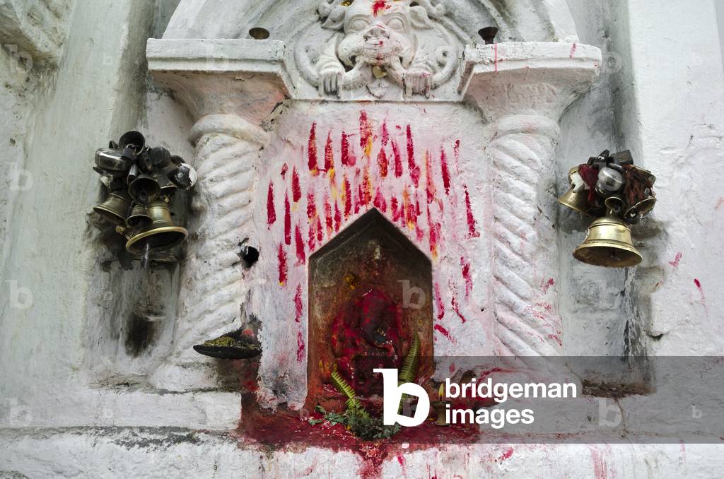 Image of Hinduism/Small shrine to Hindu god Ganesh in wall of Tibetan