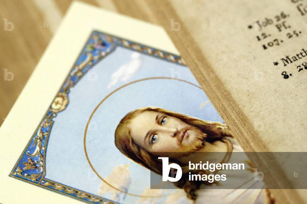 Holy picture with Jesus and old Bible, 18th century, France (photo) by